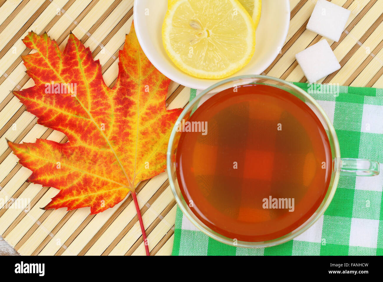Glass of tea, autumn leaf and lemon Stock Photo - Alamy