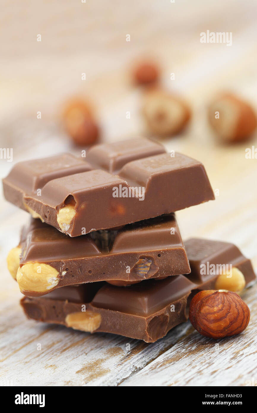 Milk chocolate with hazelnuts stack Stock Photo - Alamy