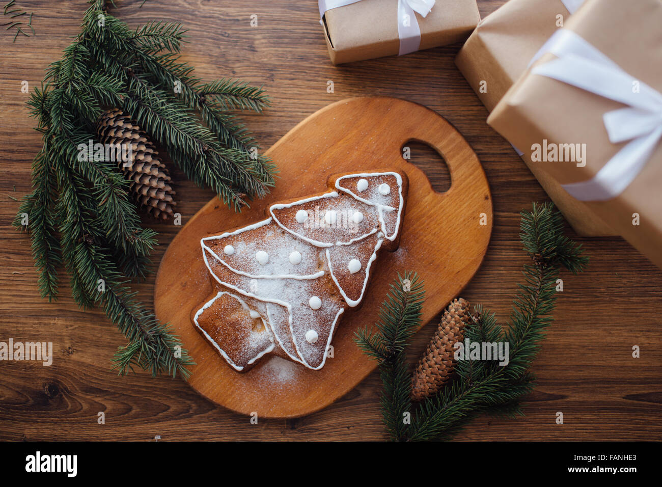 Big baked Christmas tree lying on the table with cones Stock Photo - Alamy