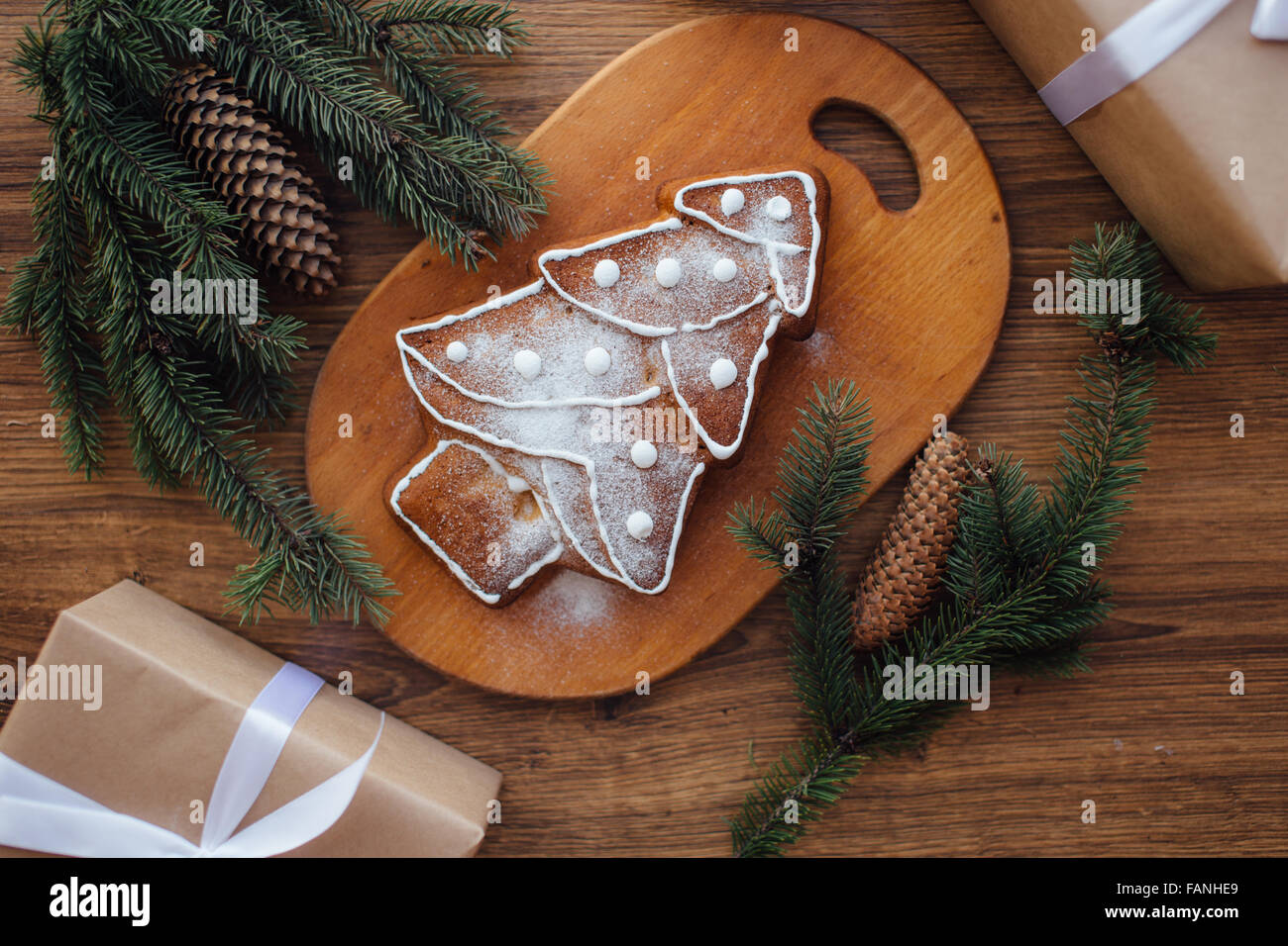 Big baked Christmas tree lying on the table with cones Stock Photo - Alamy