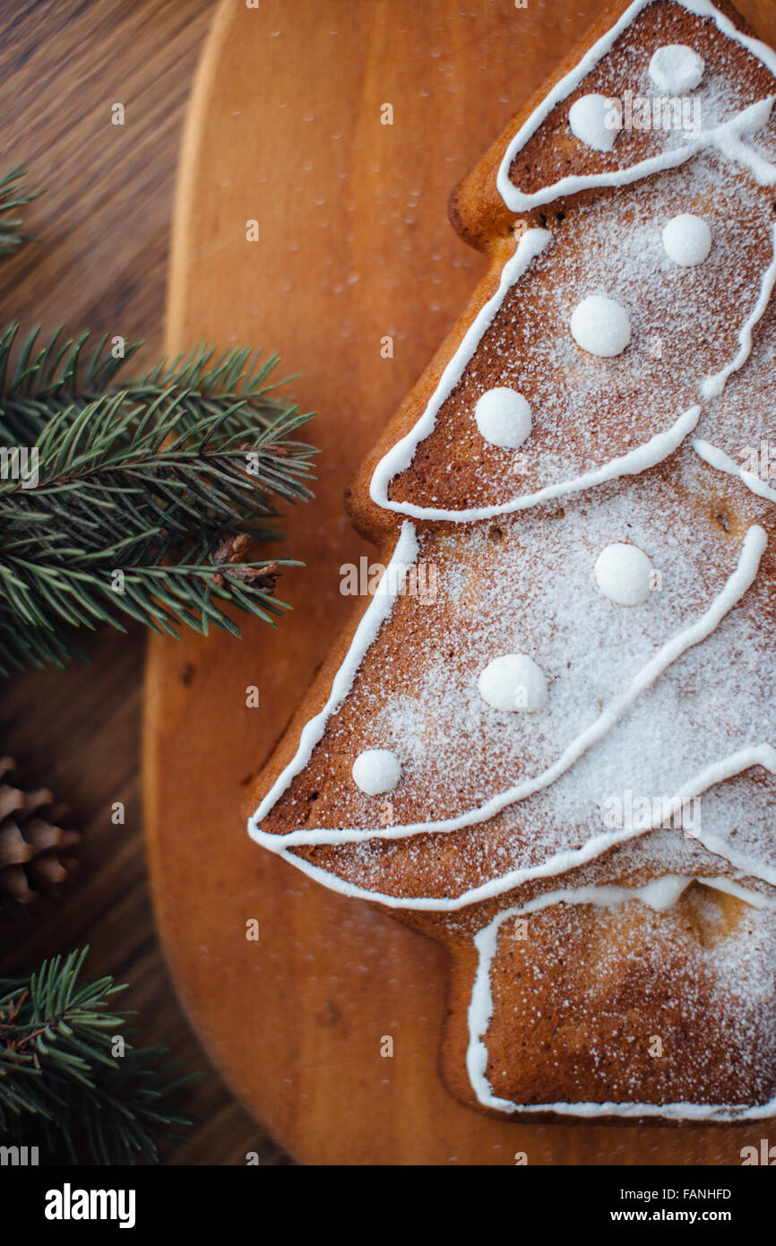 Big baked Christmas tree lying on the table with cones Stock Photo - Alamy