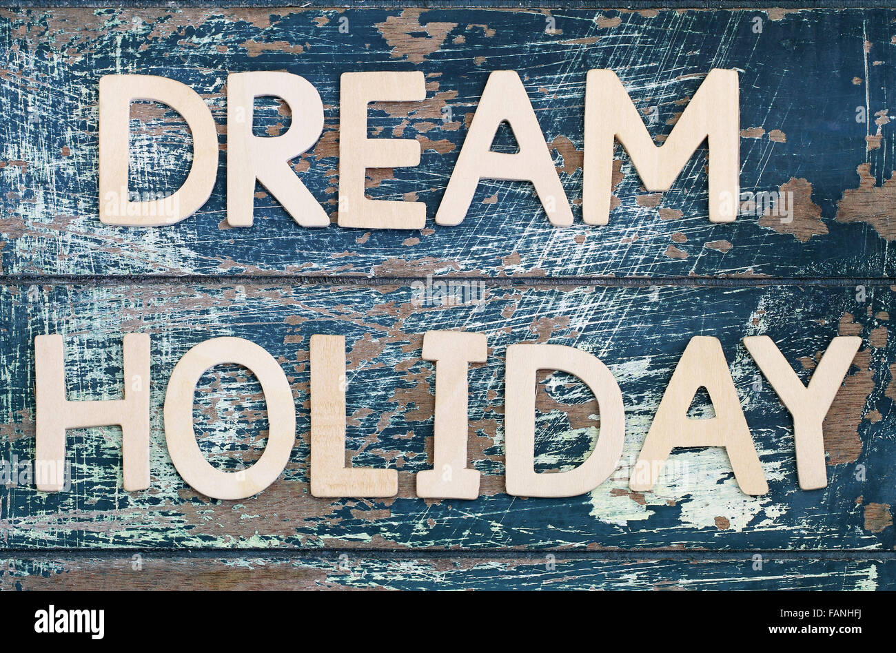 Dream holiday written with wooden letter on rustic surface Stock Photo ...