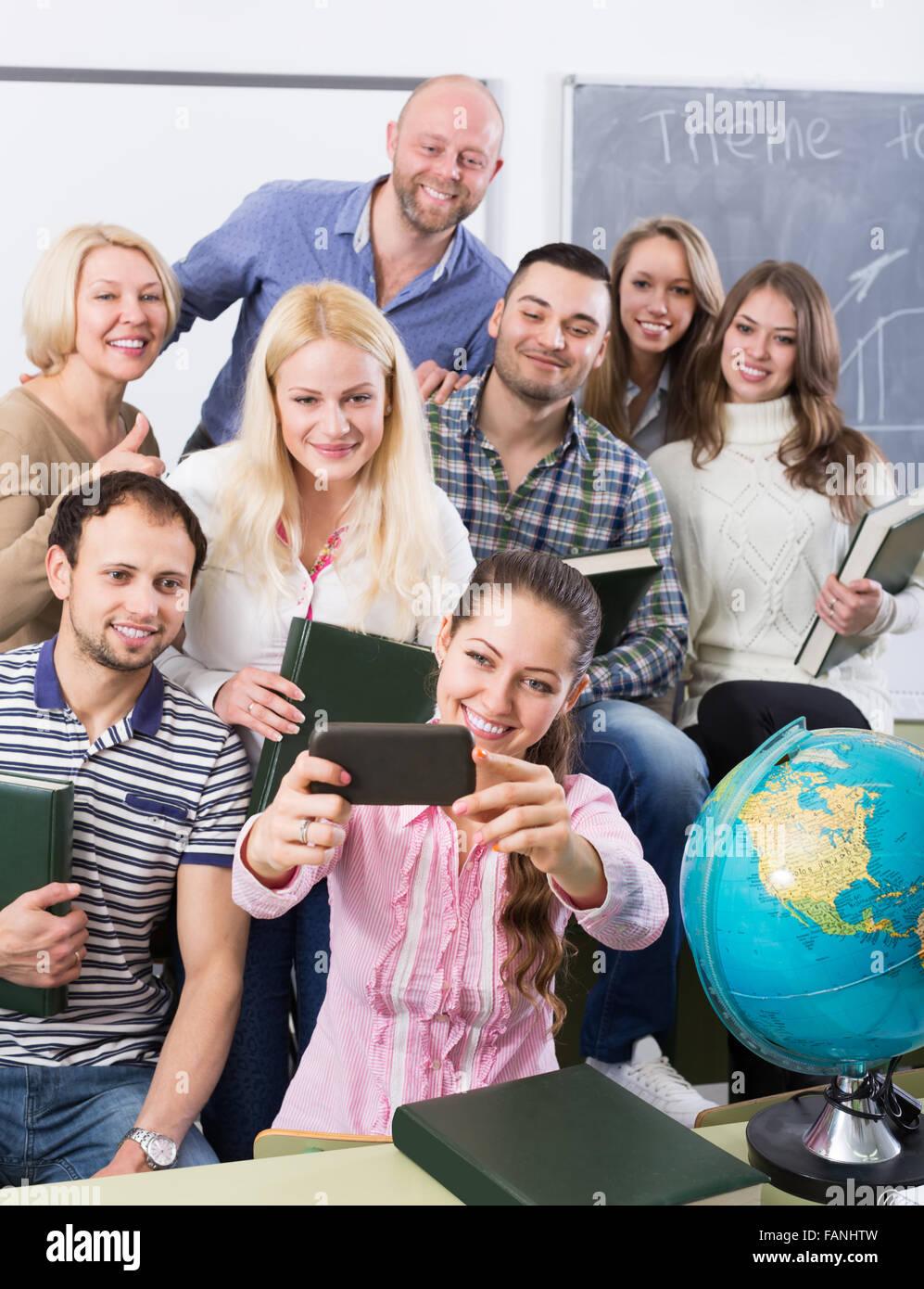 happy students of different age doing group selfie on smartphone Stock ...
