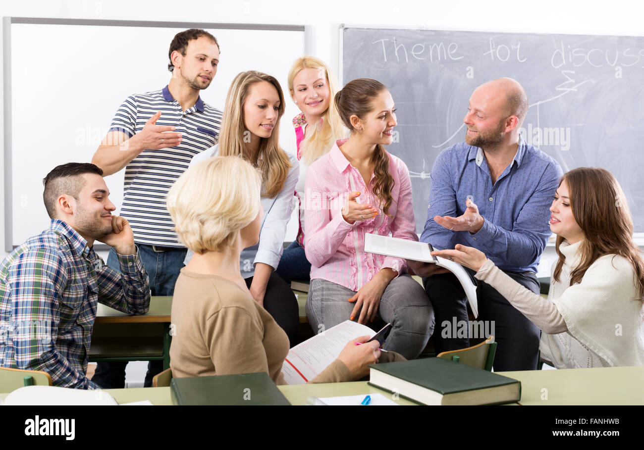 Teacher and smiling students during break in classroom Stock Photo - Alamy