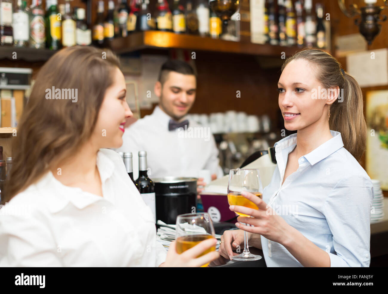 Two beautiful girls flirting handsome hi-res stock photography and ...