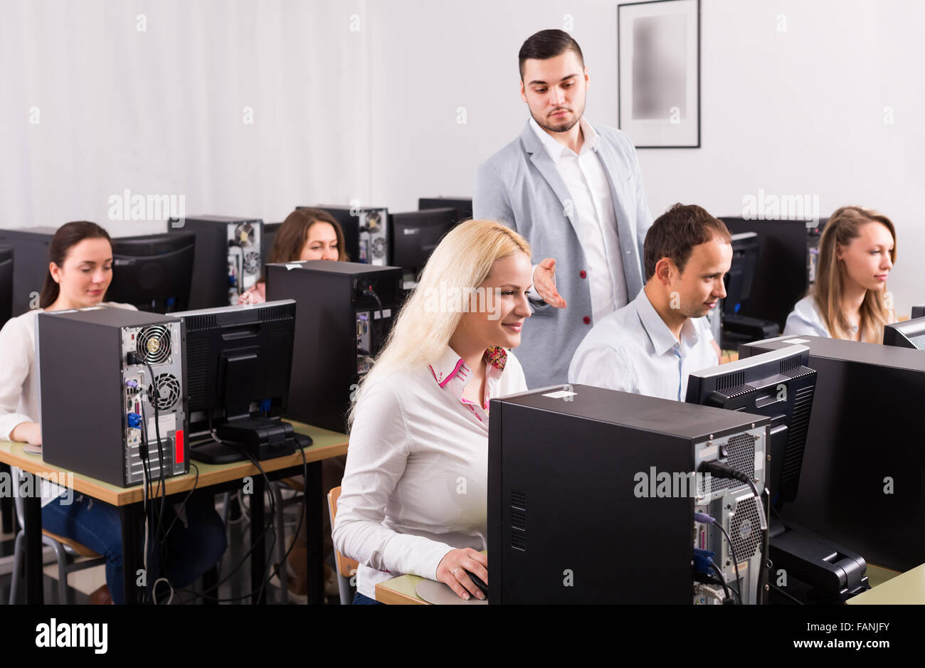 Successful supervisor giving instructions to office positive team Stock ...