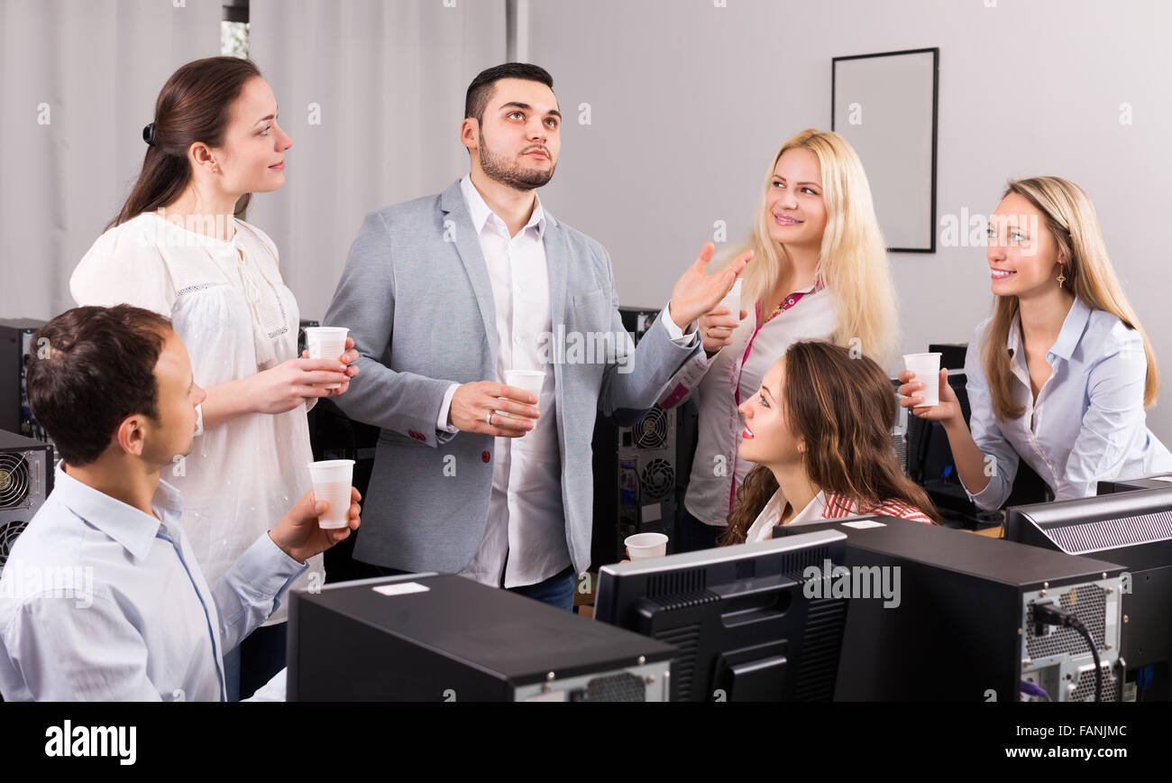 Happy young business team celebrating successful project close-out ...