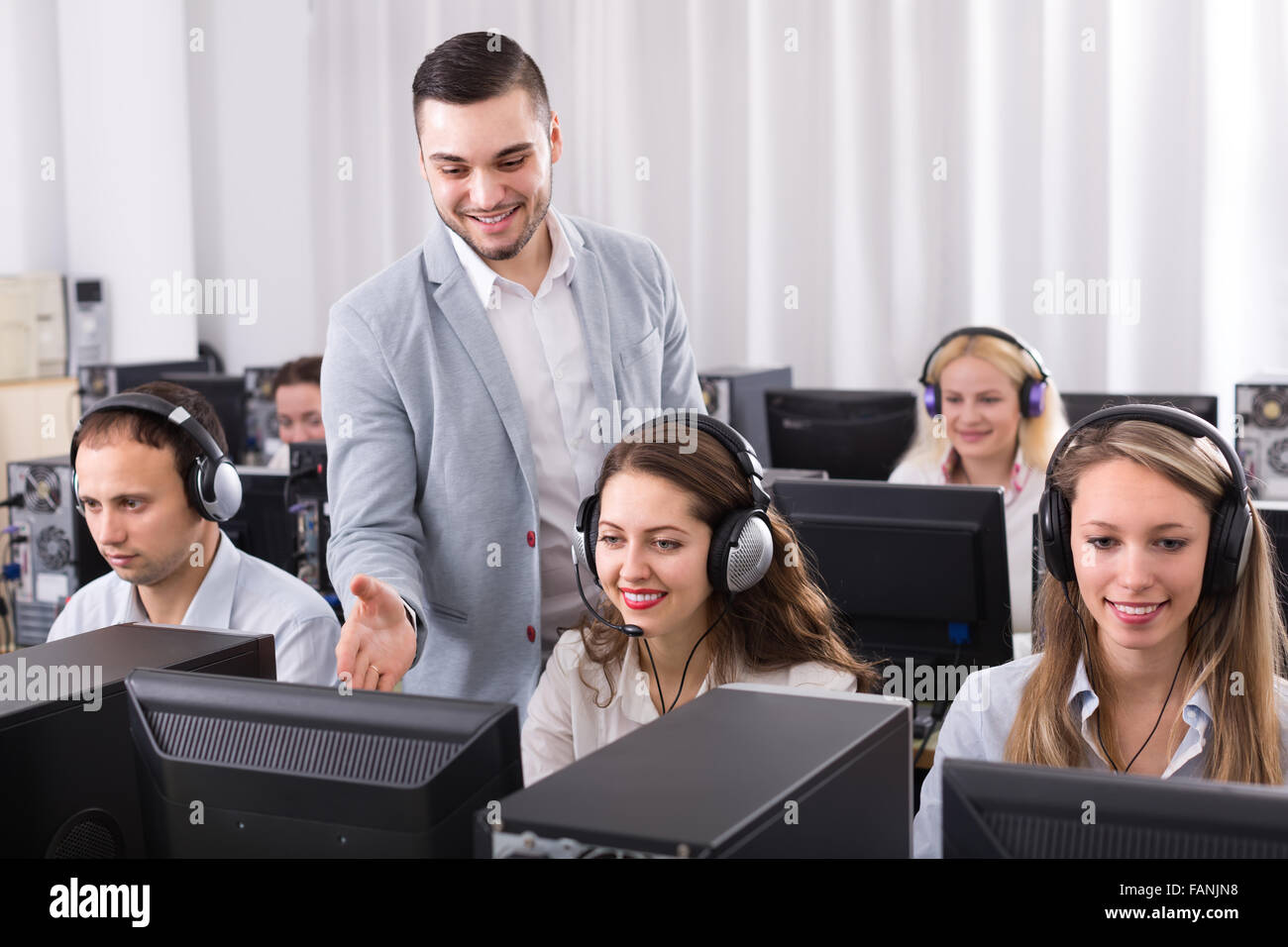 Satisfied supervisor and employees of technical support line Stock ...