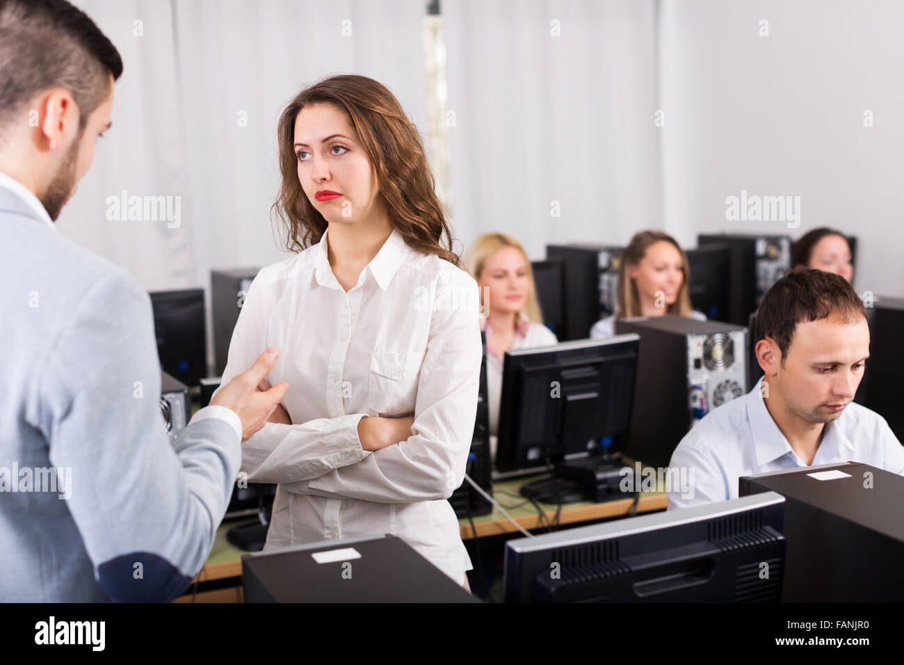 Strict boss and crying clerk at open space working area Stock Photo - Alamy