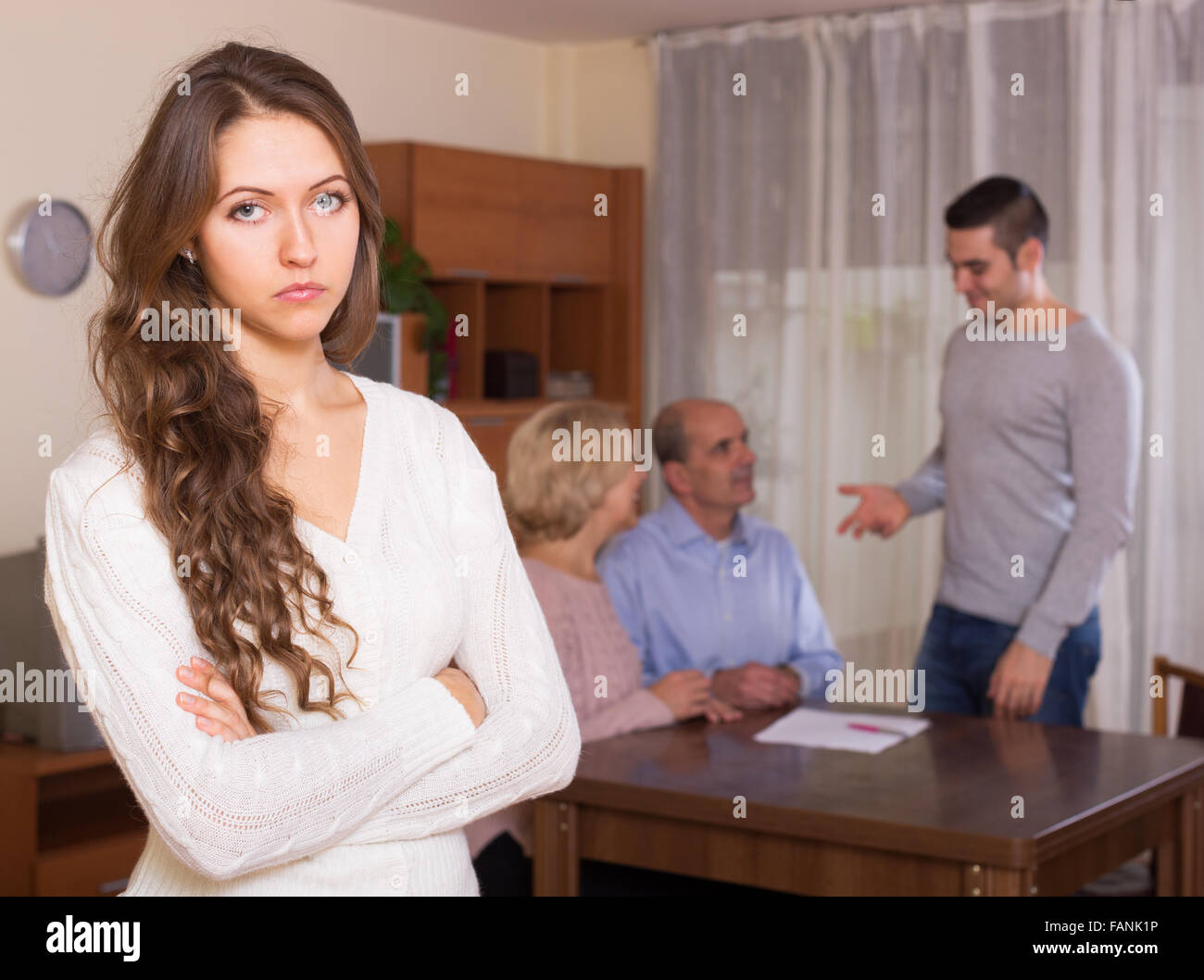 Girl faced with misunderstanding family Stock Photo - Alamy