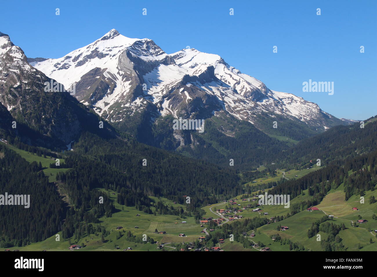 Beautiful snow capped Oldenhorn, high mountain in the Bernese Oberland ...