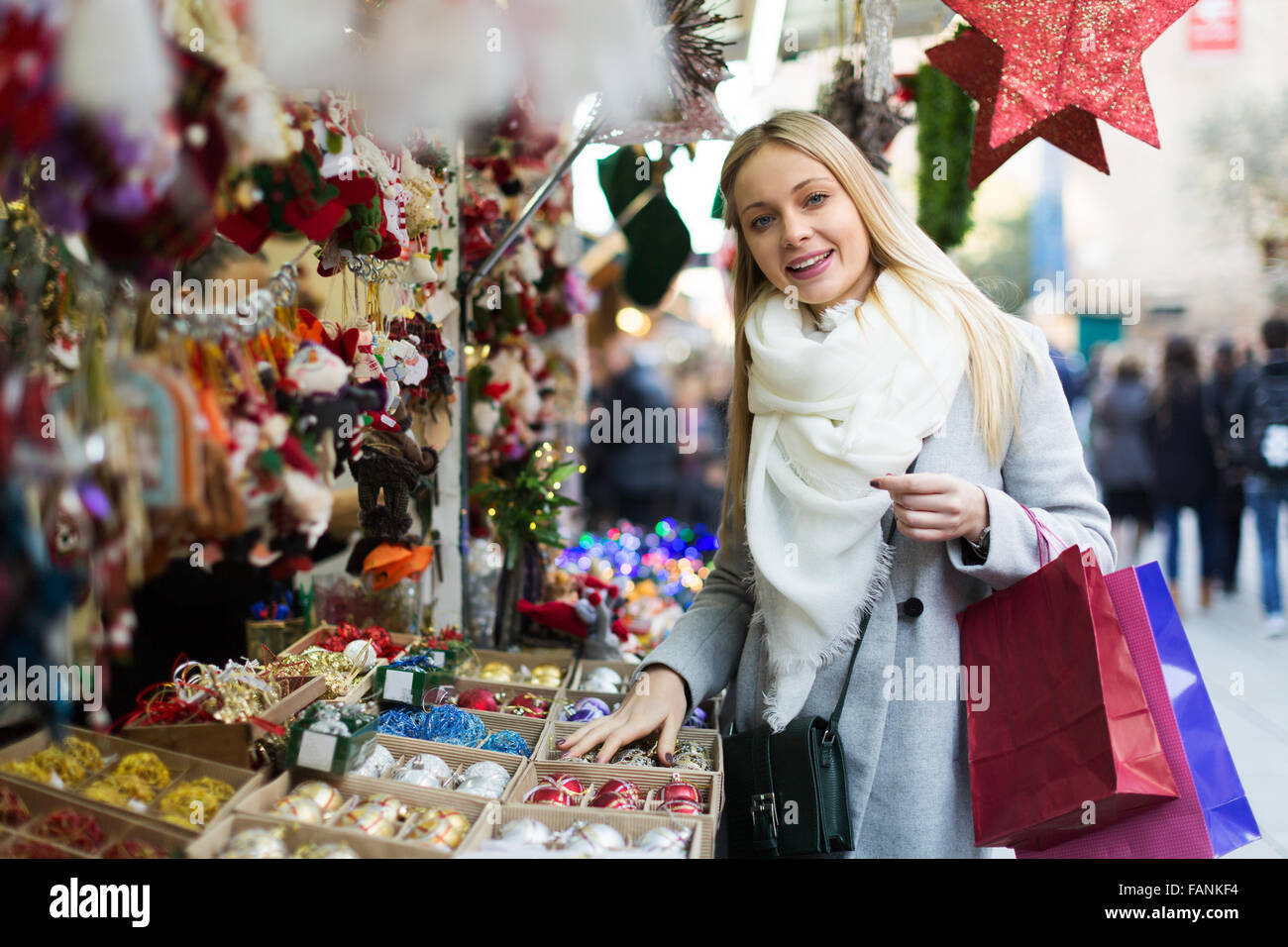 Portrait of 20-25 years old female customer near counter with Christmas ...