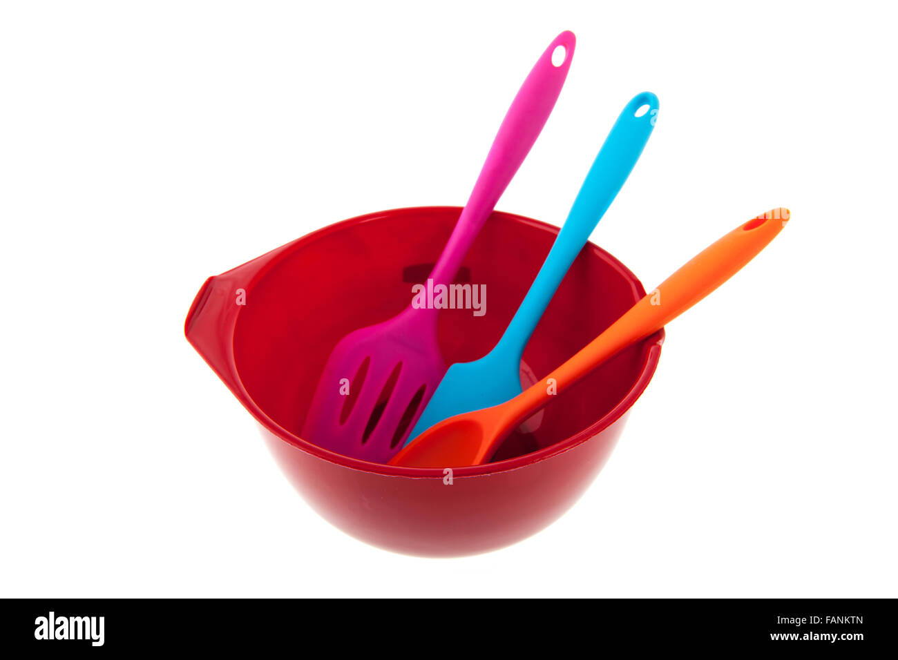 Red bowl with kitchen tools isolated over white background Stock Photo ...