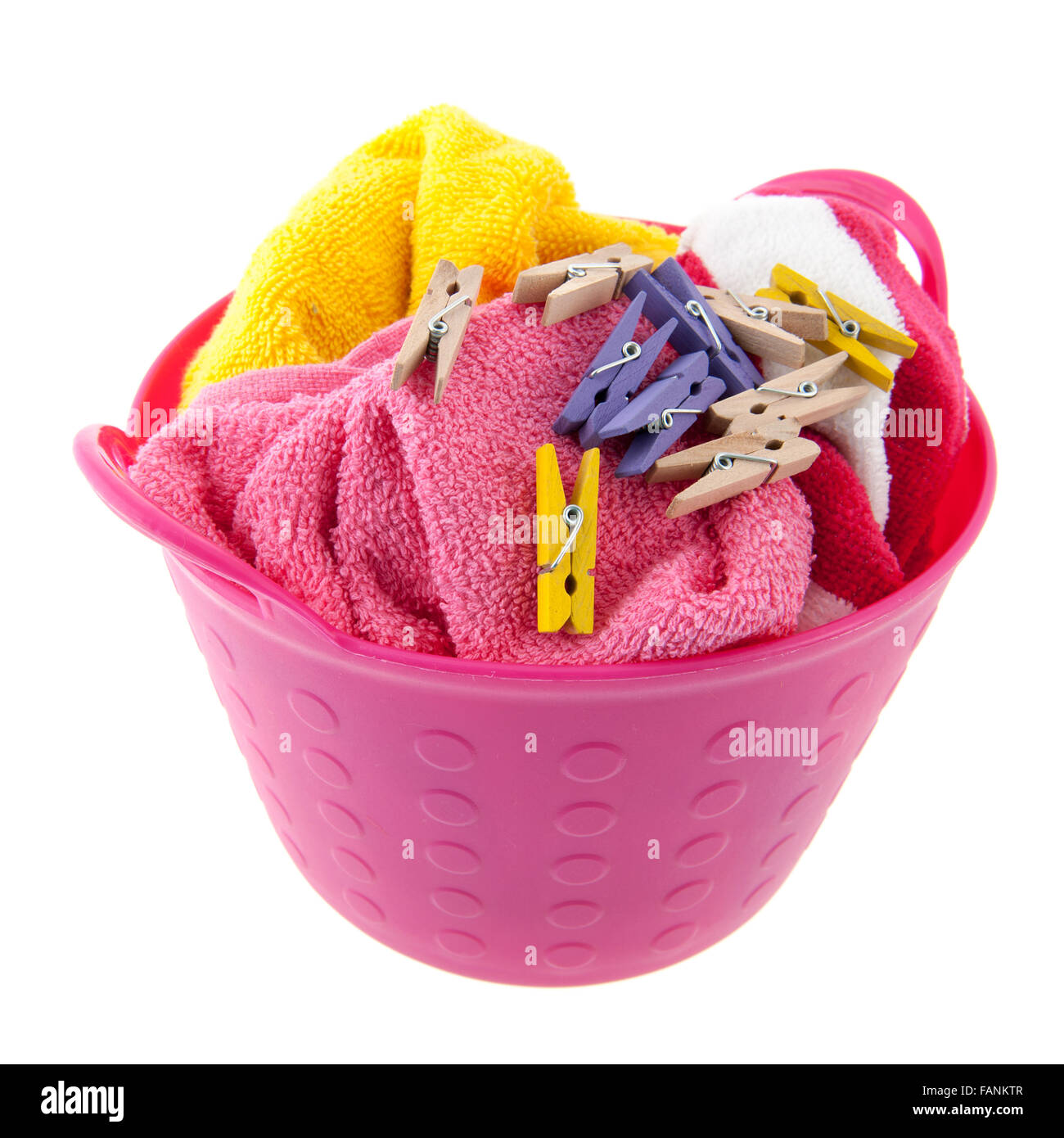 Full laundry basket with towels and clothes pins Stock Photo - Alamy