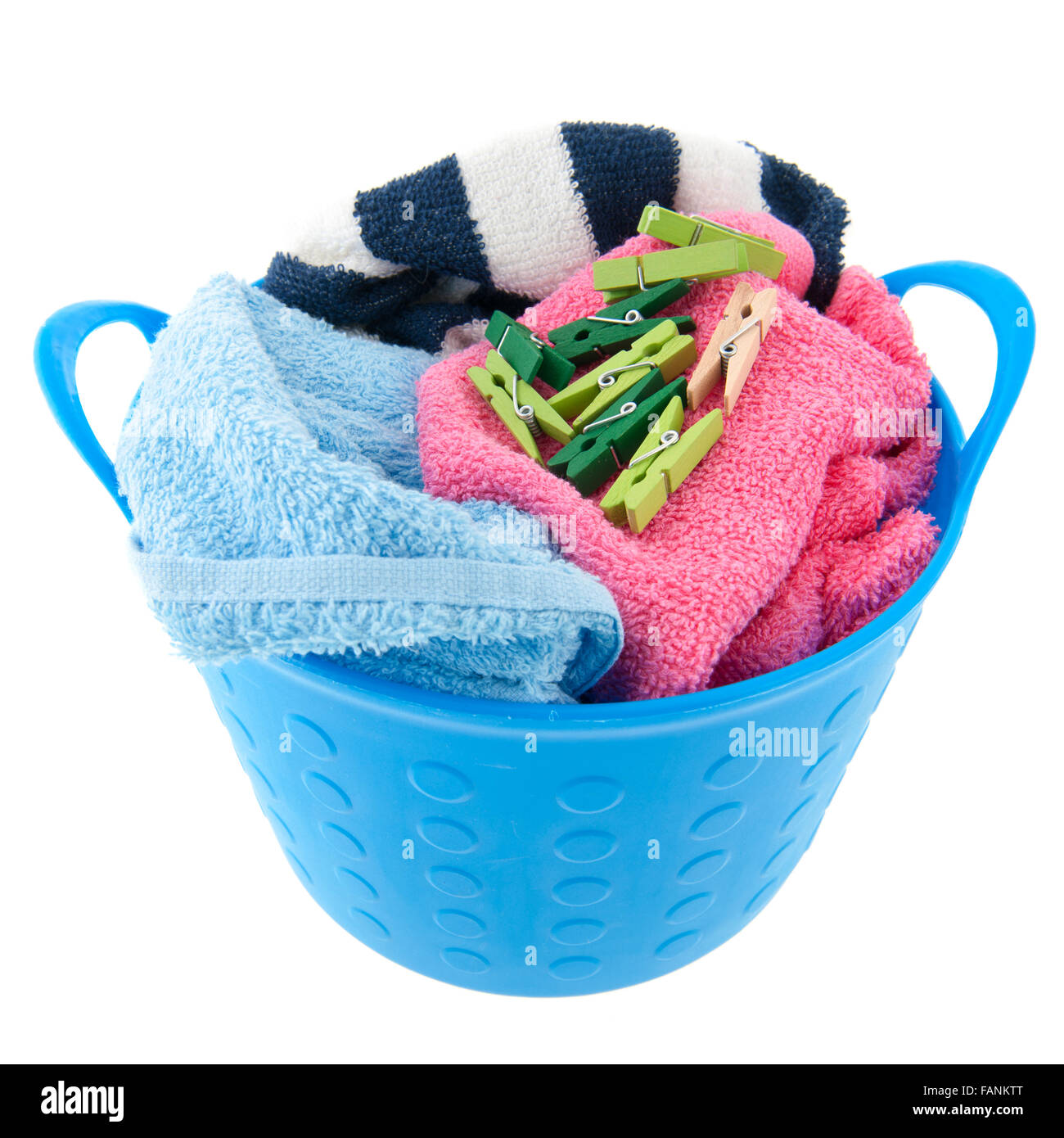 Full laundry basket with towels and clothes pins Stock Photo - Alamy