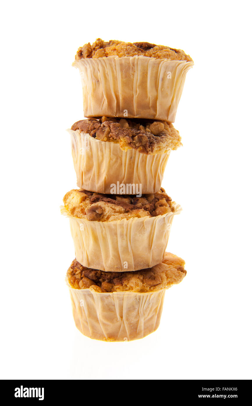Stacked hazelnut muffins isolated over white background Stock Photo - Alamy