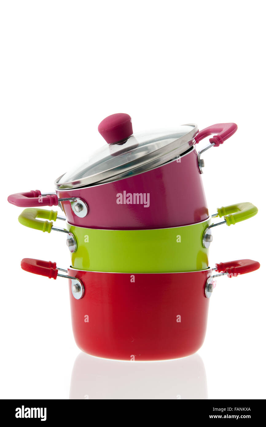 Stacked pots for cooking isolated over white background Stock Photo - Alamy
