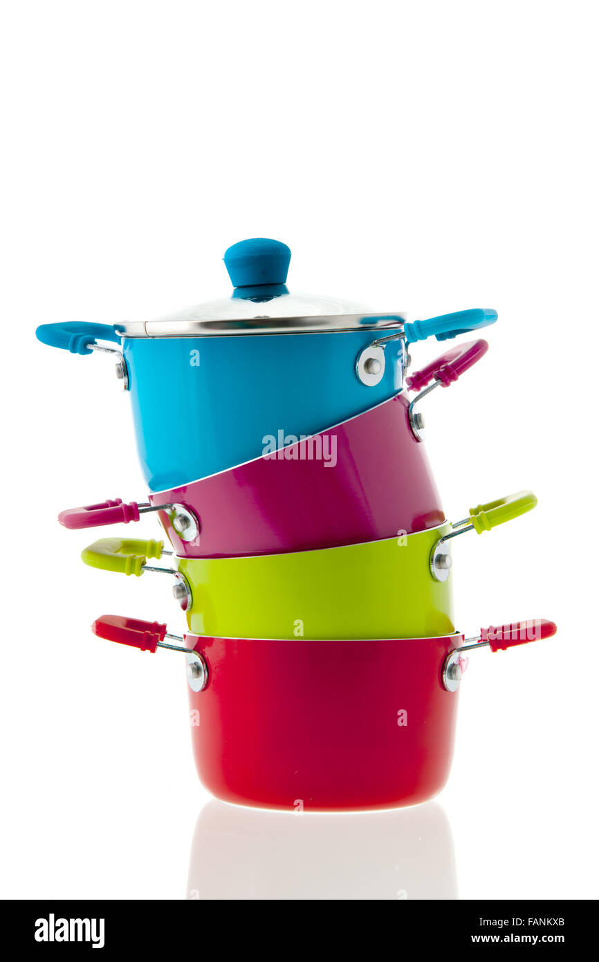 Stacked pots for cooking isolated over white background Stock Photo - Alamy