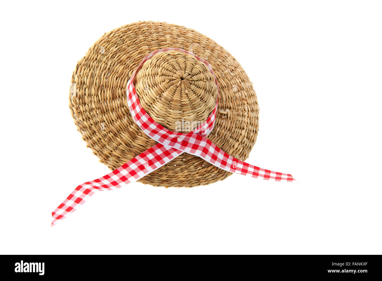 wicker summer hat with red checkered ribbon Stock Photo - Alamy