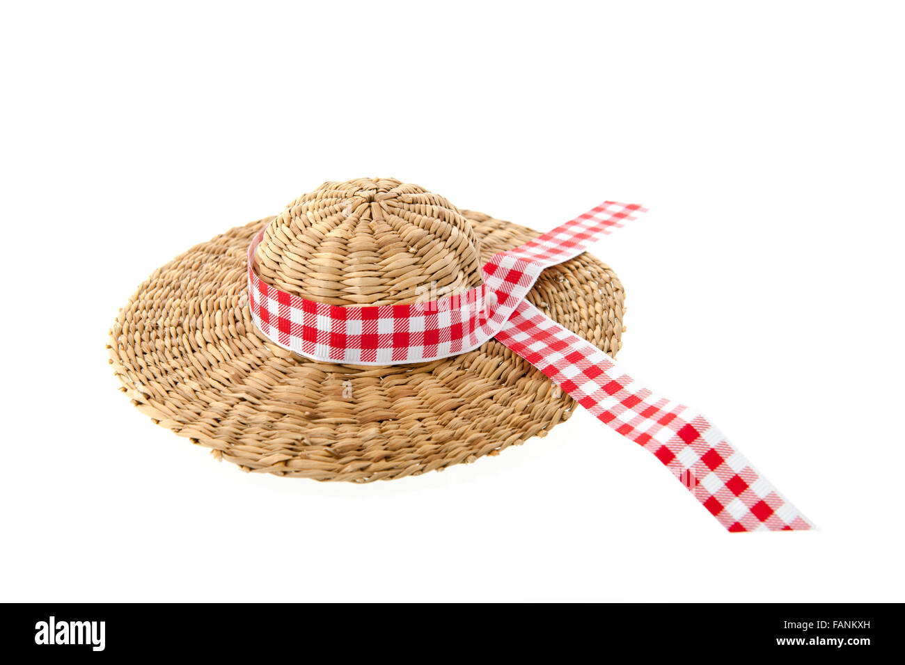 wicker summer hat with red checkered ribbon Stock Photo - Alamy