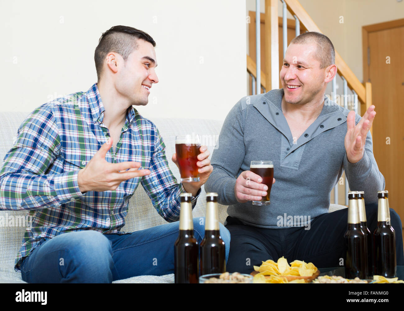 Two men talking drinking beers hi-res stock photography and images - Alamy