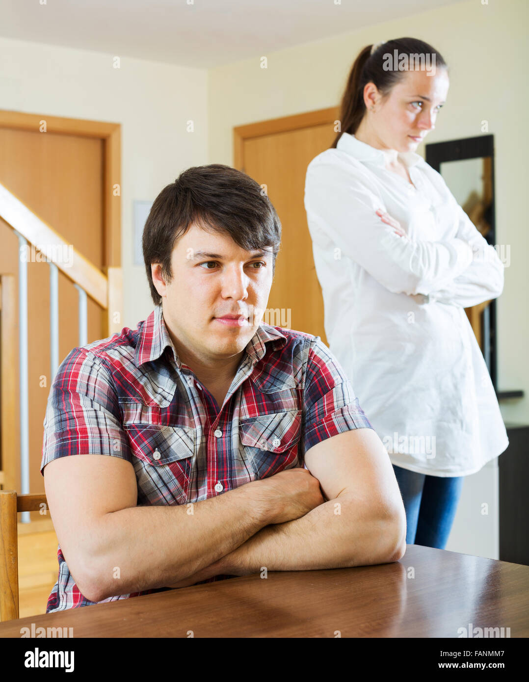 Young married couple having serious quarrel Stock Photo - Alamy