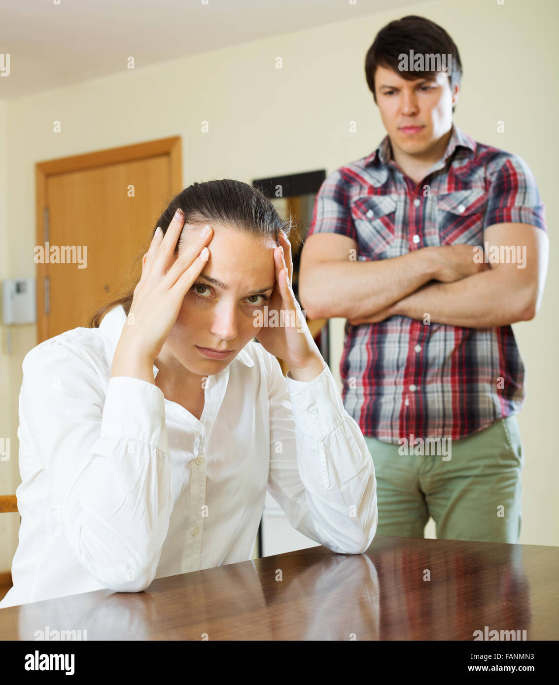 Young married couple having conflict at home interior Stock Photo - Alamy