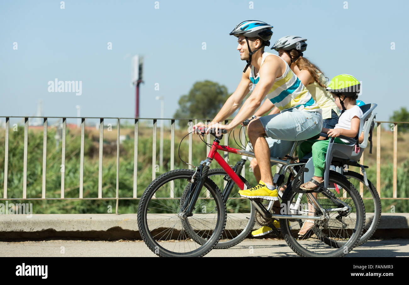 Bike ride young family with two kids in a summer day Stock Photo - Alamy