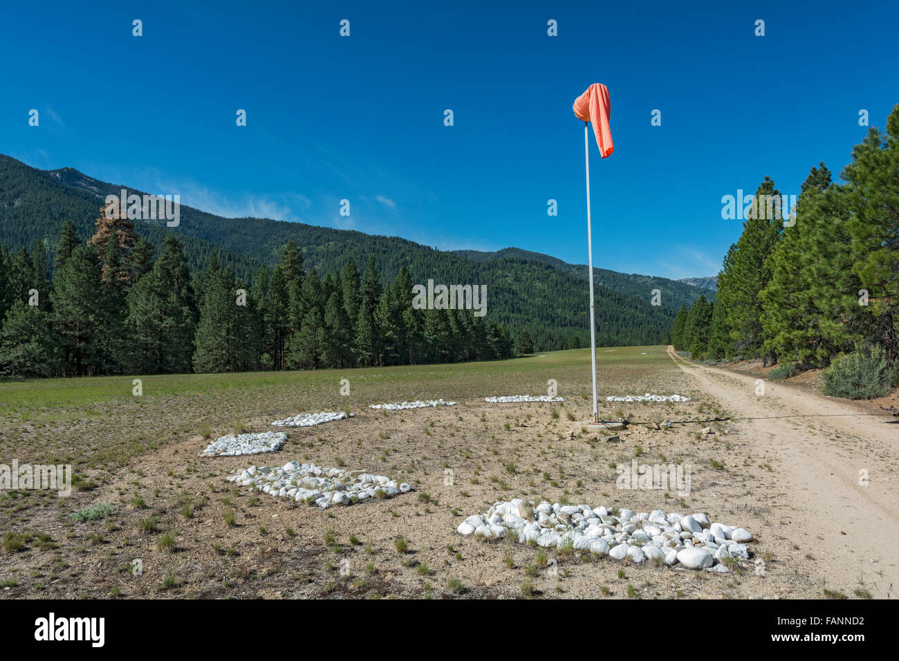 Idaho, Warm Springs Creek Airport, turf runway, windsock Stock Photo ...