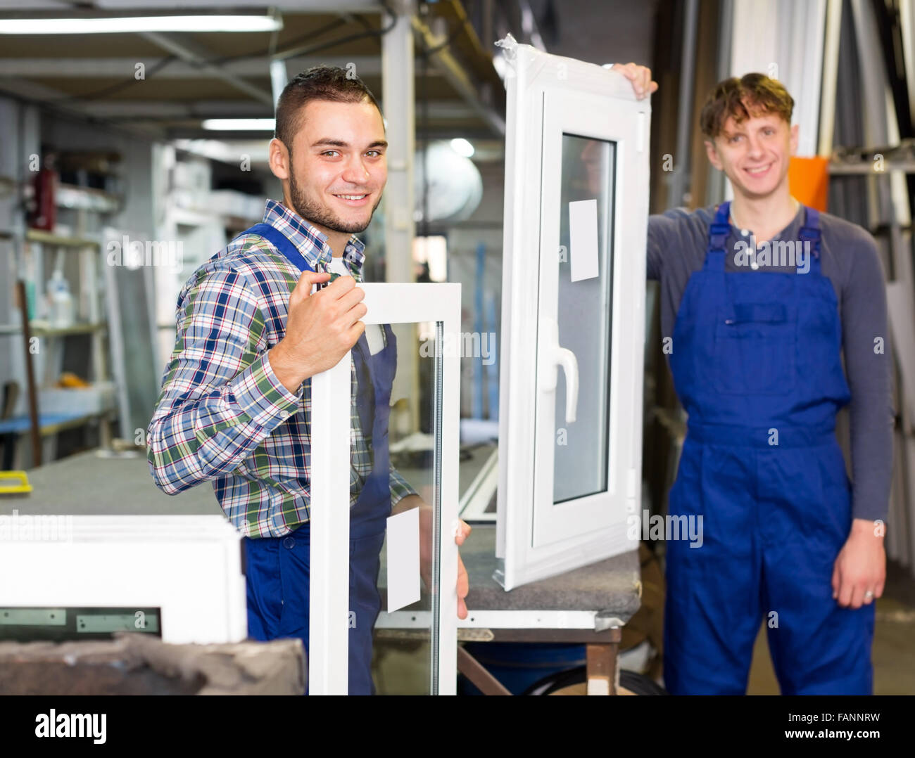 Production smiling workers in coverall with different PVC window Stock ...
