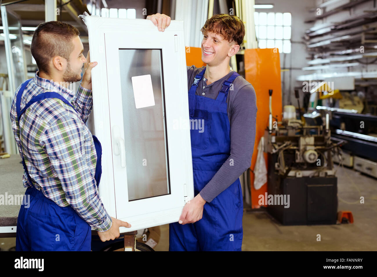 Two men inspecting windows at modern plant Stock Photo - Alamy