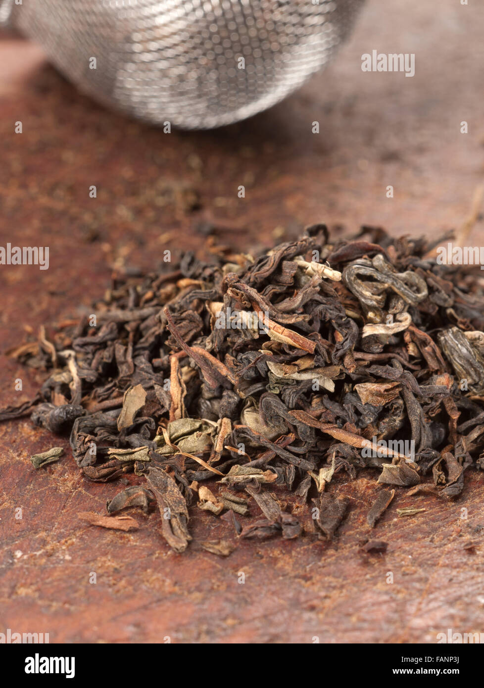 Black tea with on a board, close up shot Stock Photo - Alamy