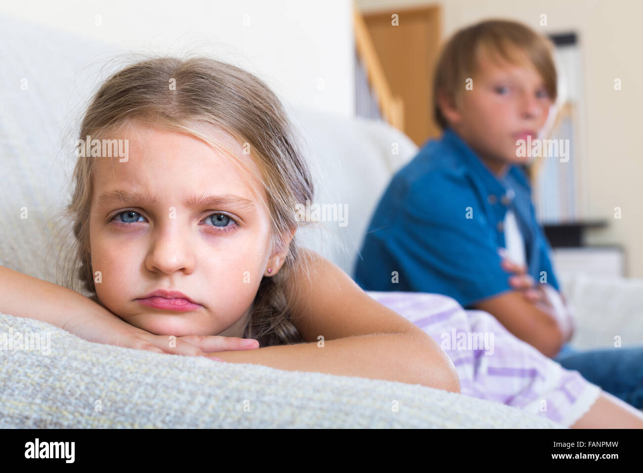 Offended children having serious quarrel in domestic interior Stock ...