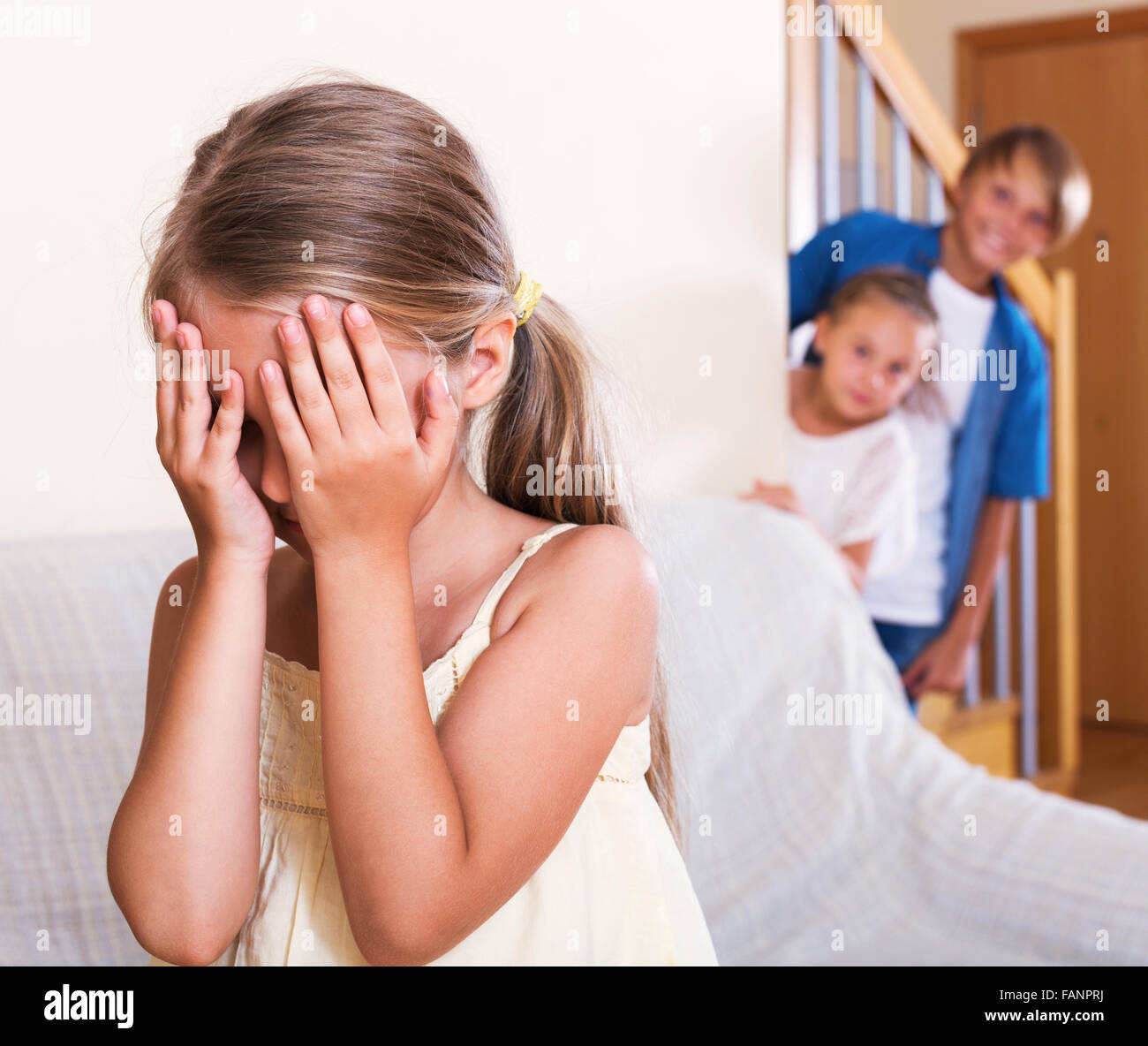 Funny smiling children hiding from girl with closed eyes during game ...