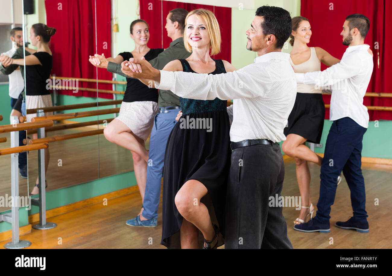 adult spanish men and women enjoying of tango in class Stock Photo - Alamy