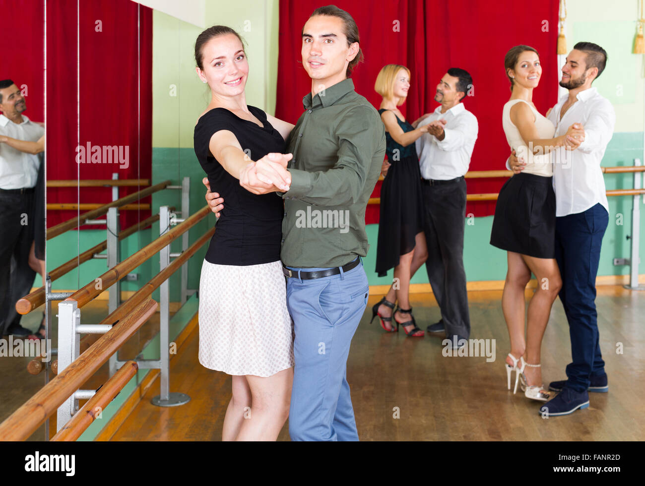 smiling people having dancing class in studio Stock Photo - Alamy