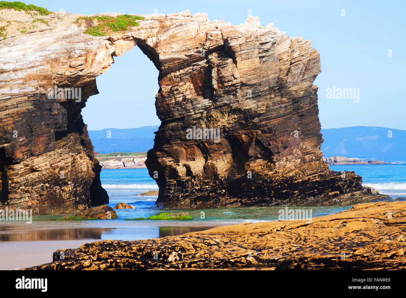 Natural arch at As Catedrais beach in sunny day. Atlantic Ocean coast ...
