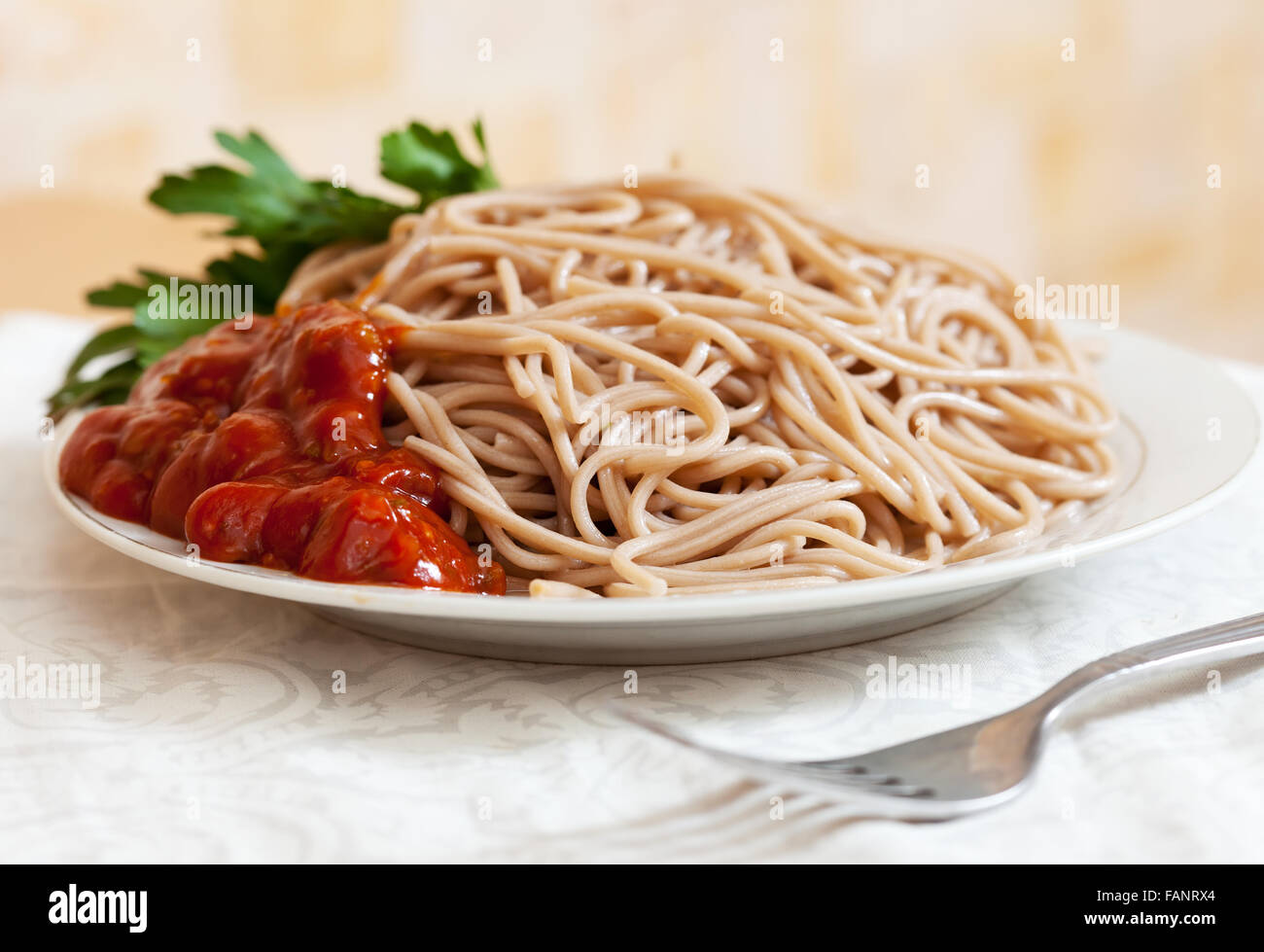 spaghetti pasta with tomato catchup on plate Stock Photo - Alamy