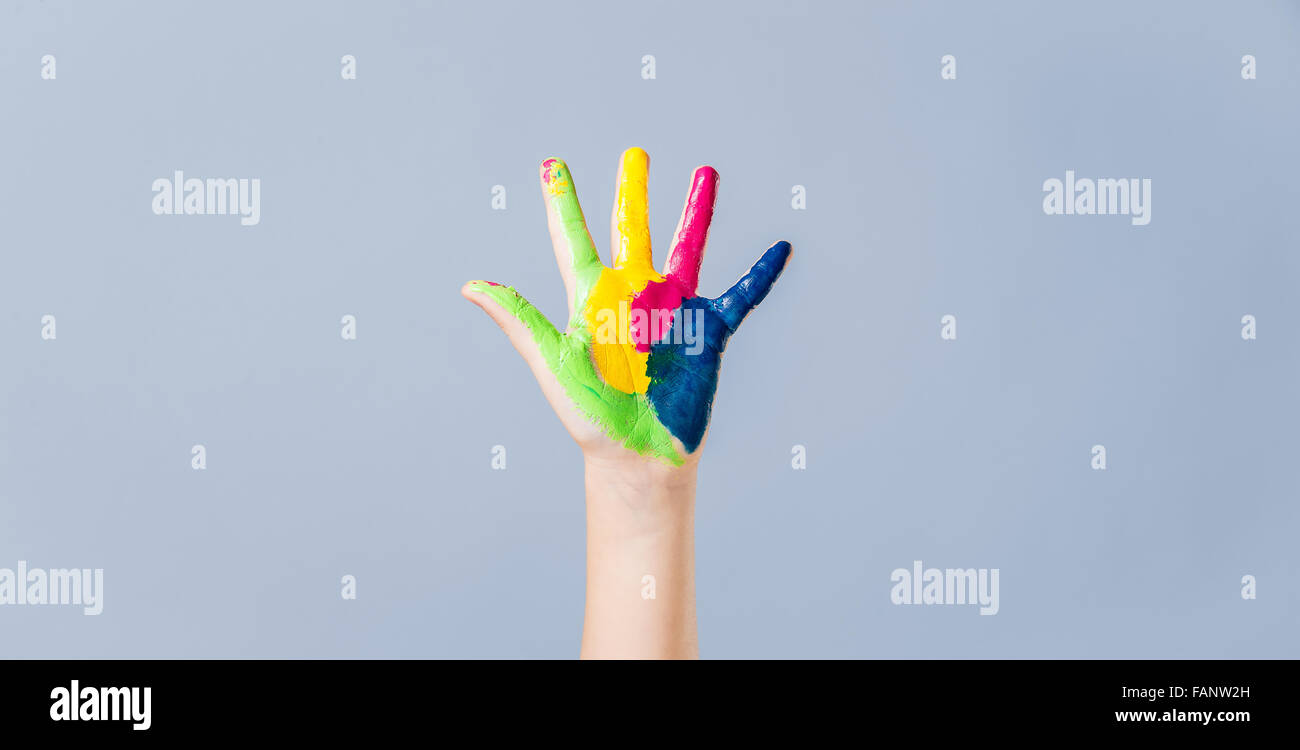 Child painted hand face hi-res stock photography and images - Alamy
