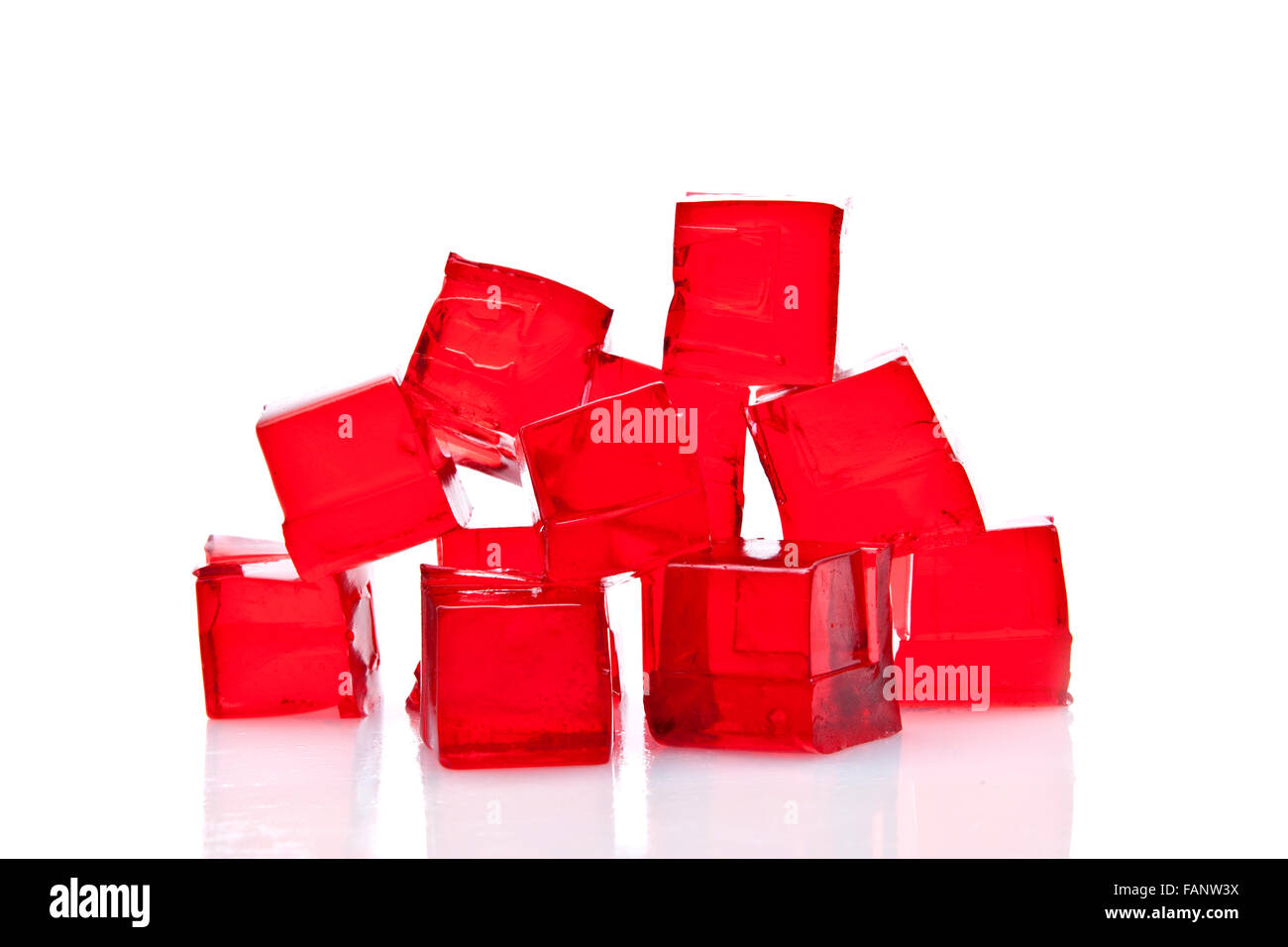 Cubes of red jelly on a white background Stock Photo - Alamy