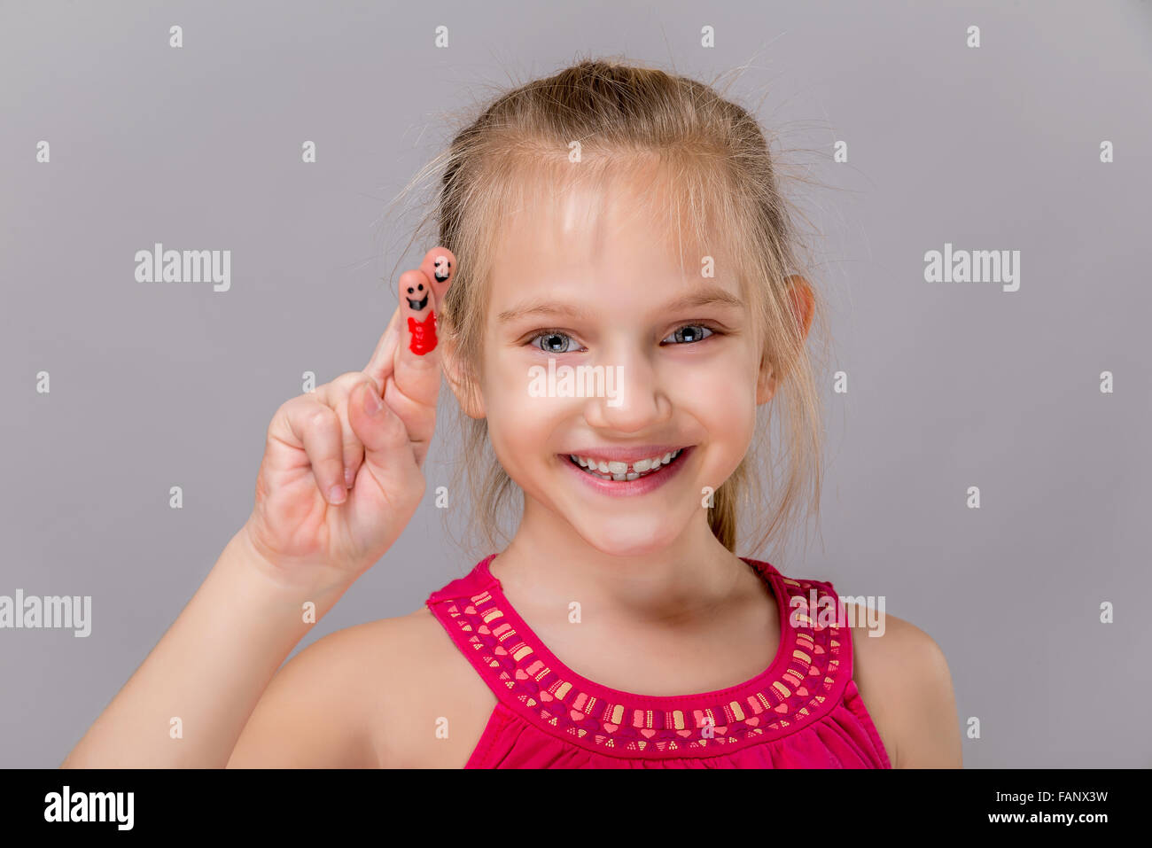Child painted hand face hi-res stock photography and images - Alamy