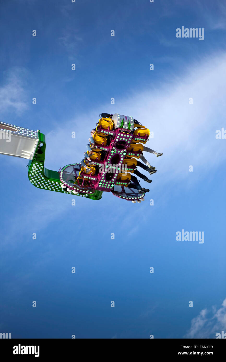 Teens on a ride at the fairground Stock Photo - Alamy