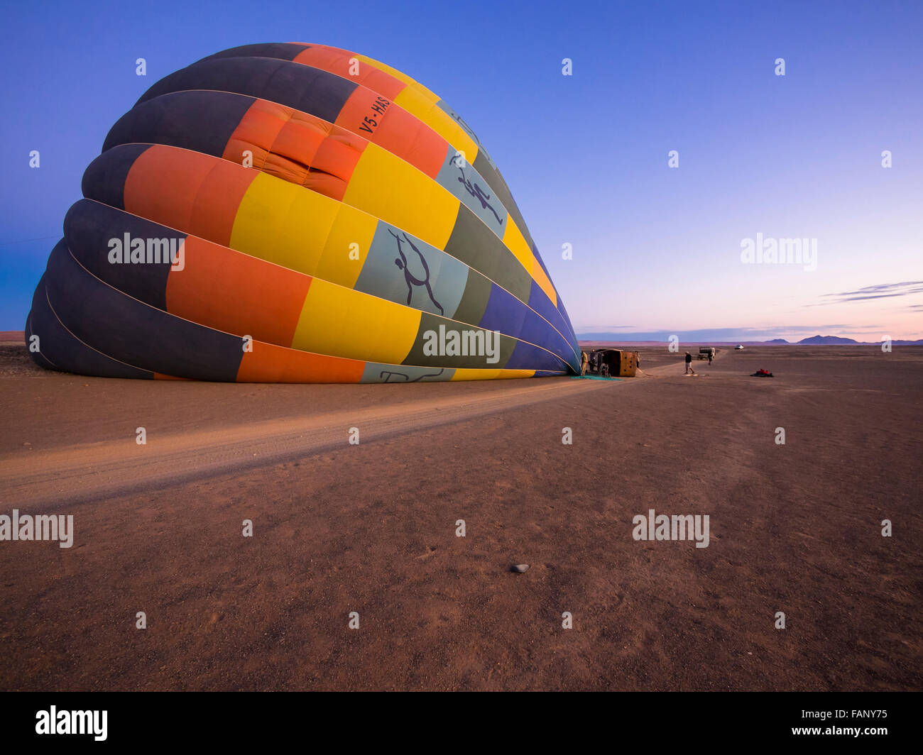 Hot air balloon being filled with air, Kulala Wilderness Reserve, Namib ...