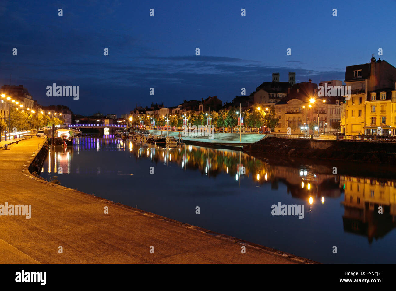 Night time view of the main quay across the River Meuse in Verdun ...