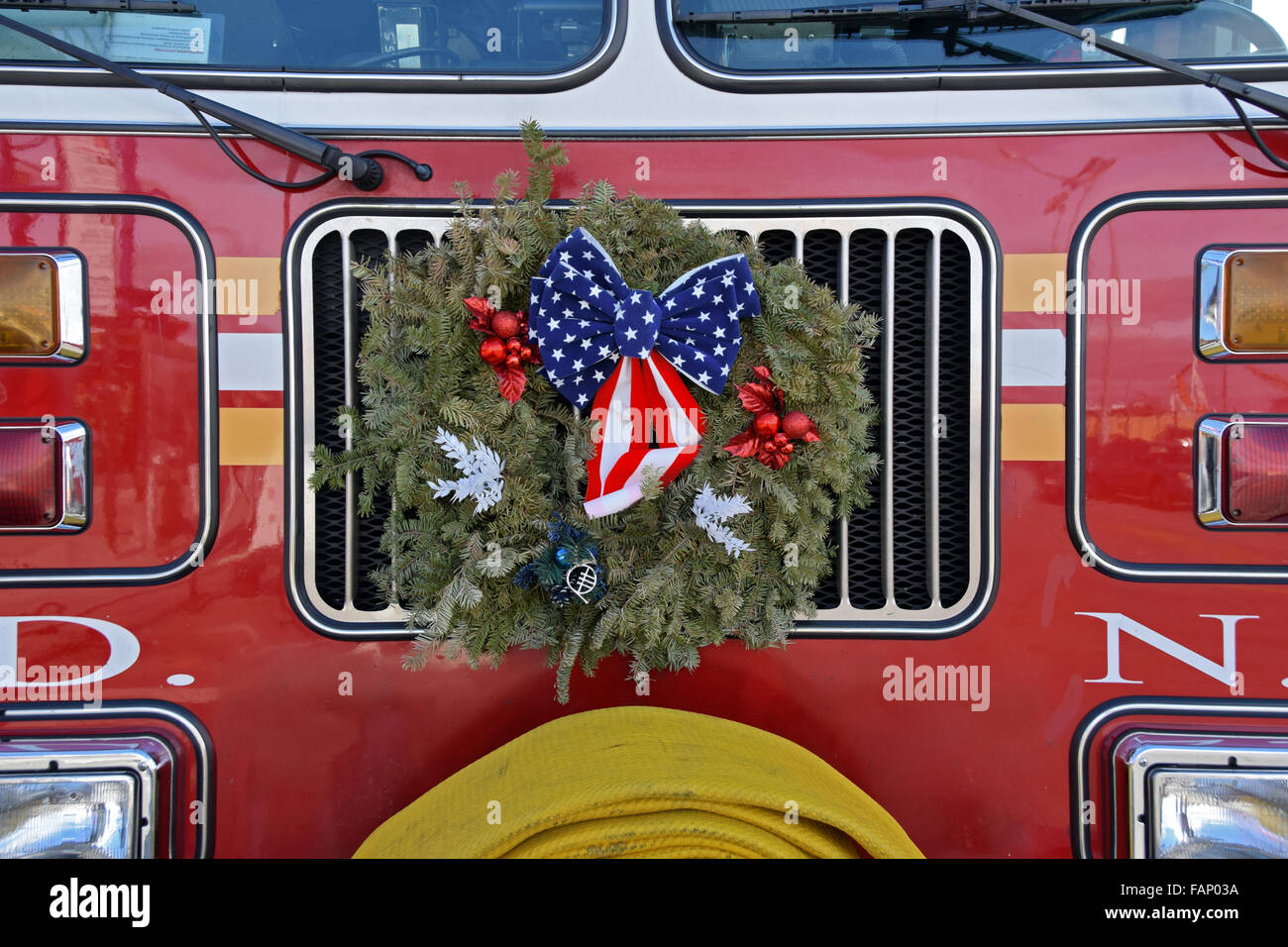 A Christmas wreath with a patriotic ribbon on a New York City fire ...