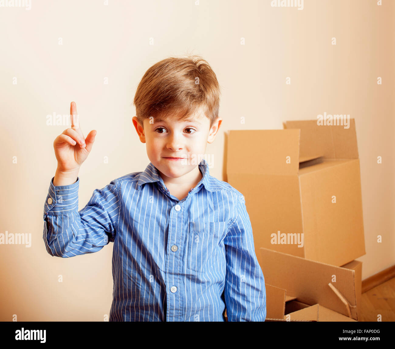 little cute boy in empty room, remoove to new house. home alone emong ...
