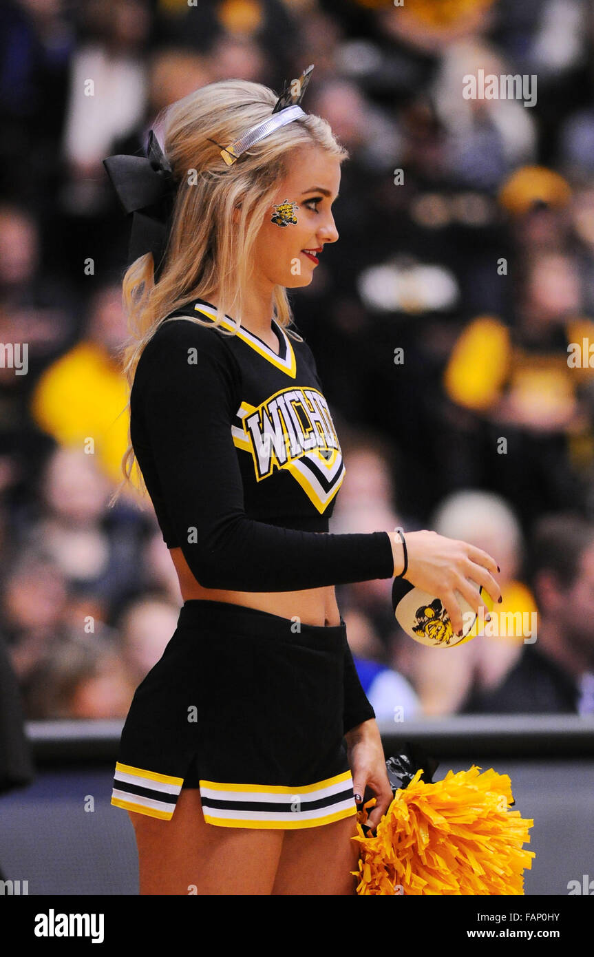 Wichita, Kansas, USA. 31st Dec, 2015. A WSU cheerleader prepares to ...