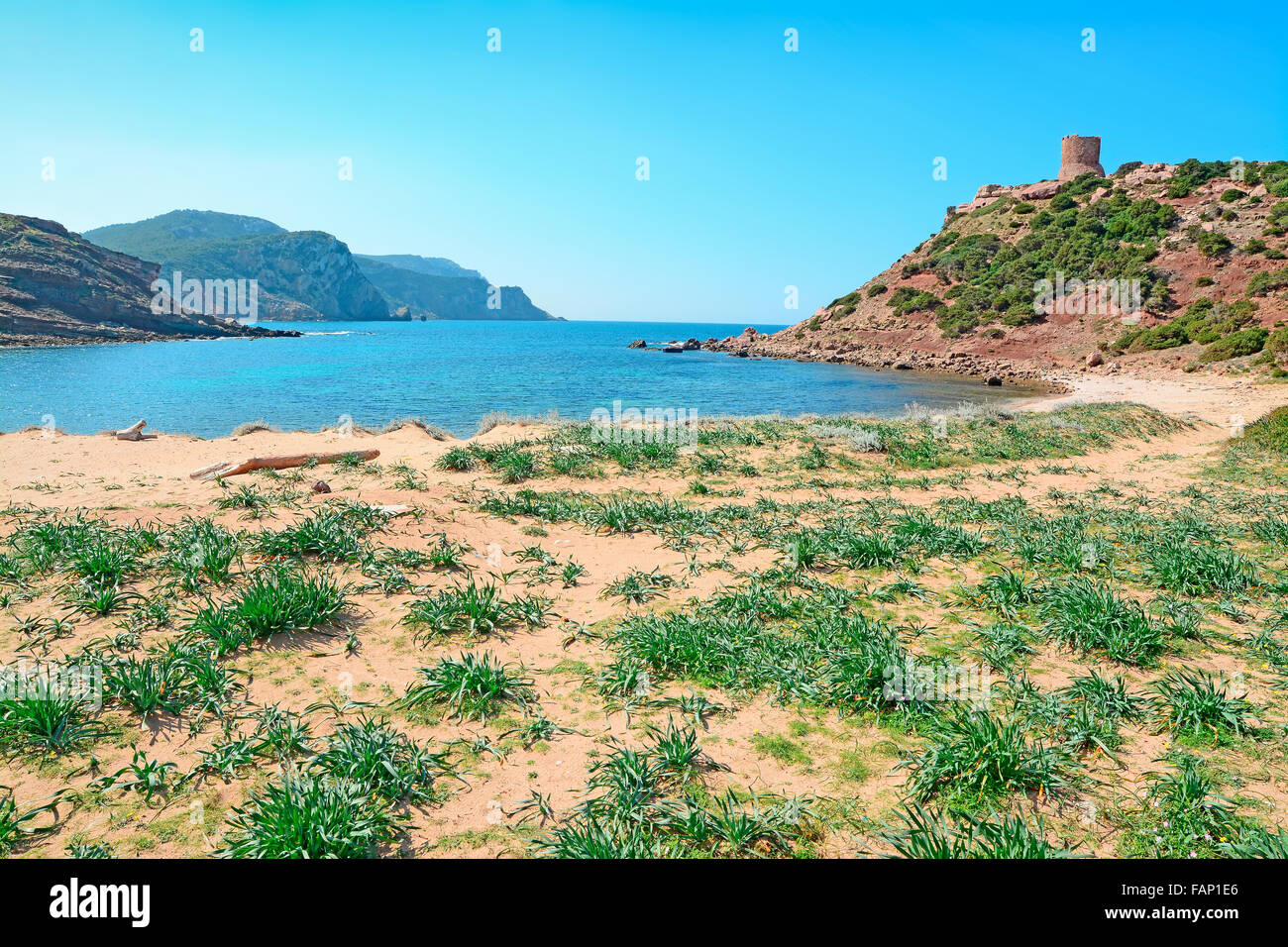 Porticciolo beach with its sighting tower, Sardinia Stock Photo - Alamy