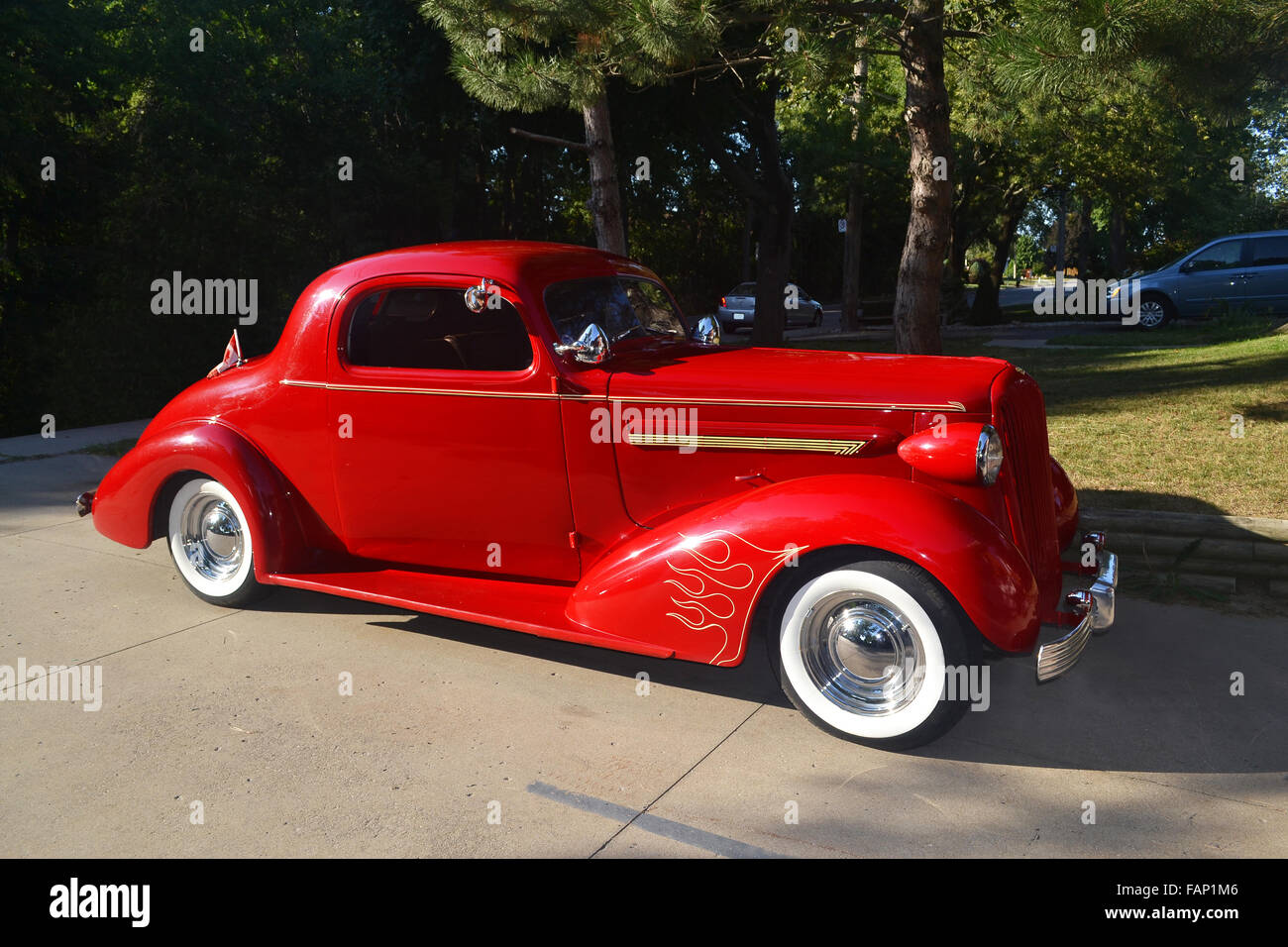 A beautiful red old car from around 1936, two door Buick with white ...