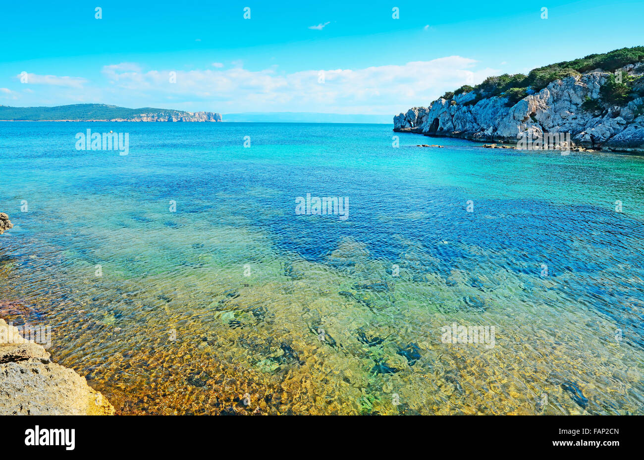 Porticciolo beach with its sighting tower, Sardinia Stock Photo - Alamy